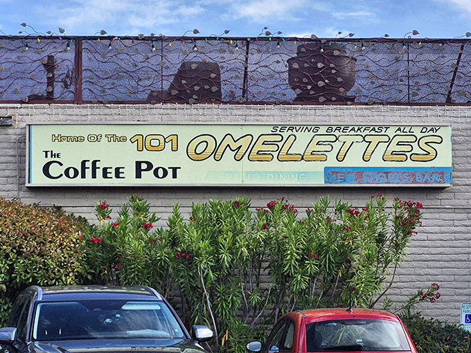 The iconic Coffee Pot sign promises "101 Omelets" &ndash; a breakfast commitment that's less a menu and more a life philosophy.