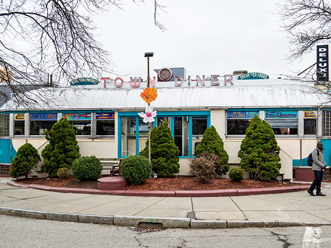 The gleaming stainless steel exterior of Deluxe Town Diner stands as a beacon of breakfast hope in Watertown, promising chrome-plated happiness inside.