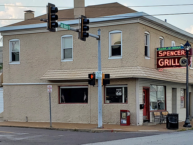 The iconic Spencer's Grill stands proudly at a Kirkwood intersection, its vintage neon sign promising breakfast delights that have satisfied locals since 1947.