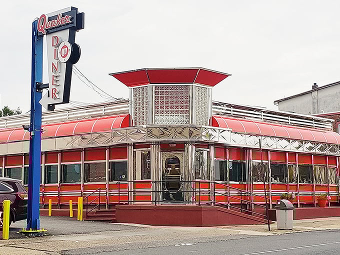 The gleaming red and chrome exterior of Quaker Diner stands as a beacon of hope for hungry Philadelphians seeking comfort food perfection.