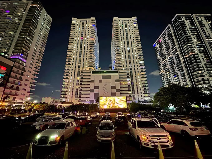 Miami's skyline creates the ultimate backdrop for movie magic at Nite Owl Drive-In, where modern high-rises frame classic cinema under starlit skies.