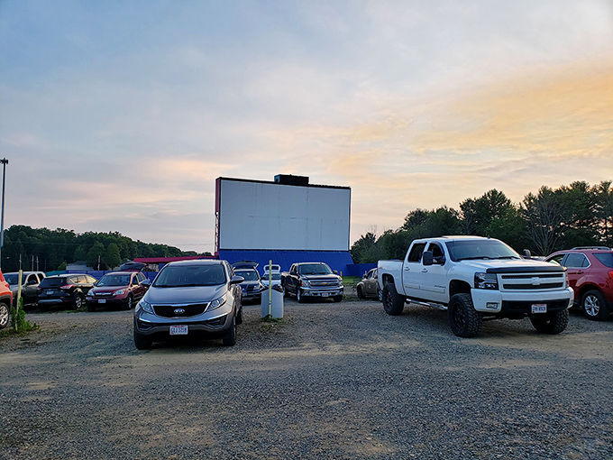 Cars gather at dusk, patiently waiting for movie magic to unfold on the massive screen at Springmill Drive-In&mdash;cinema as the movie gods intended.