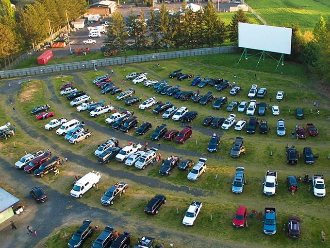 Movie magic from above. The 99W's sprawling layout reveals the perfect marriage of automobiles and entertainment, where every parking spot offers its own private theater experience.