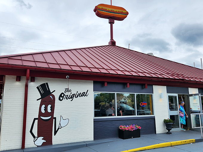 The cheerful hot dog mascot with his dapper top hat welcomes visitors to "The Original" &ndash; a promise this place has been keeping for generations.
