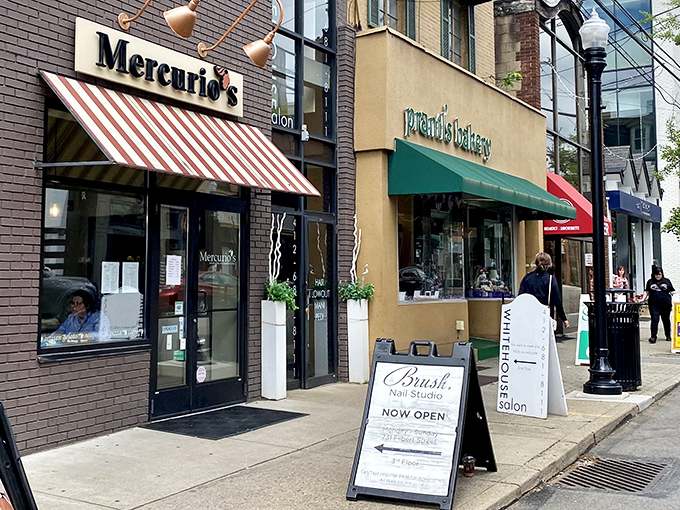 The iconic red and white striped awning of Mercurio's beckons like a culinary lighthouse on Shadyside's Walnut Street, promising authentic Italian delights within.