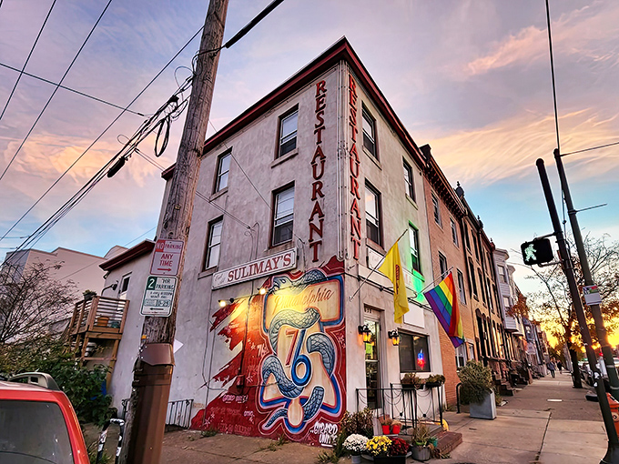 Sunset at Sulimay's – where the restaurant sign glows almost as warmly as the welcome you'll receive inside. Pure Fishtown magic.