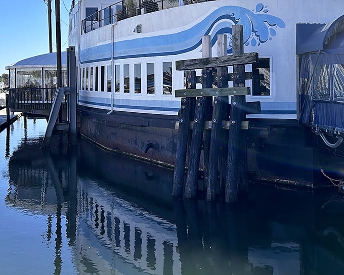 Where the ocean meets your plate &ndash; DiMillo's exterior showcases its nautical charm with wooden pilings and reflective waters.