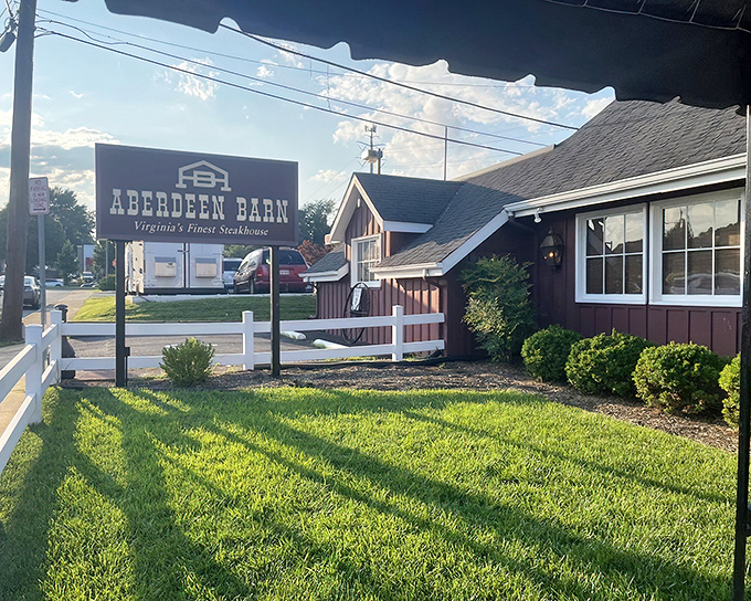 That rustic barn exterior with its classic white fence isn't just charming &ndash; it's your destination for beef nirvana.