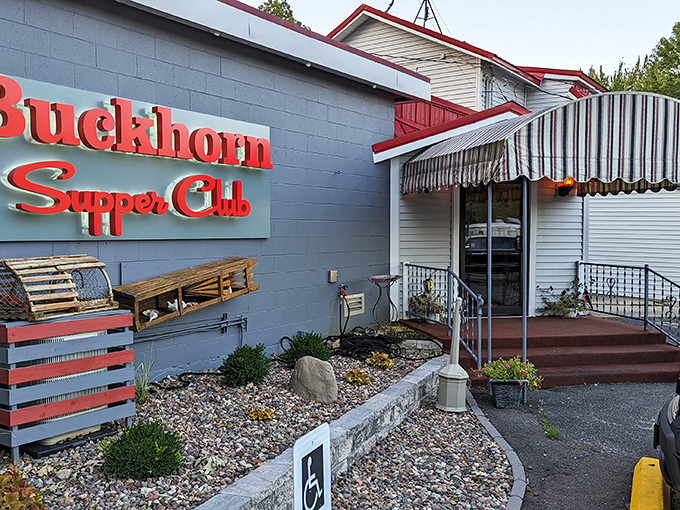 The iconic red Buckhorn Supper Club sign against the blue-gray exterior promises the kind of Wisconsin dining experience that makes vegetarians question their life choices.e