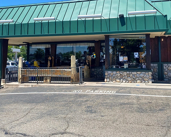 The iconic green-roofed exterior of Black Bear Diner stands like a woodland lodge that somehow wandered into Redding and decided to stay put.