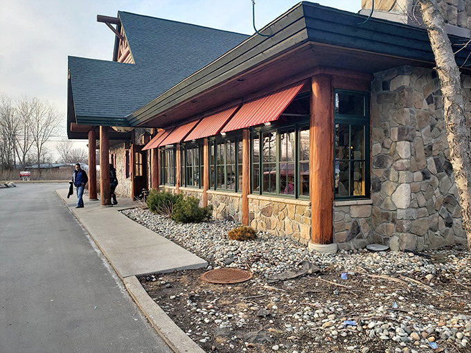 Stone and timber architecture that whispers "escape to the woods" before you even step inside.