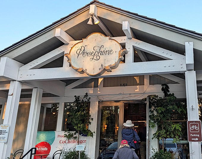 Persephone's charming white exterior welcomes visitors like a Swiss chalet that took a wrong turn and found paradise in Wyoming.