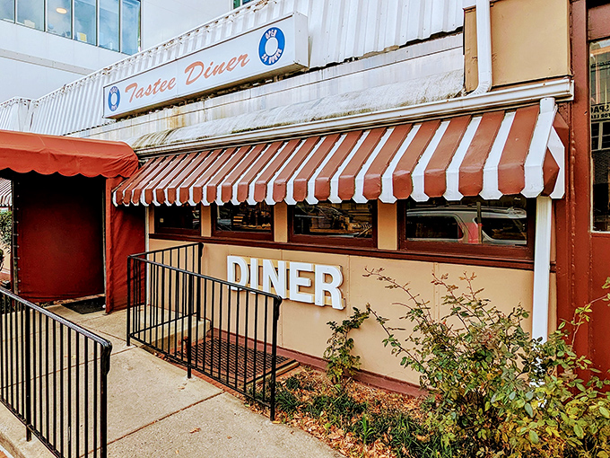 The iconic red and white awning of Tastee Diner beckons like a beacon of breakfast hope on Wisconsin Avenue. Classic Americana at its finest.