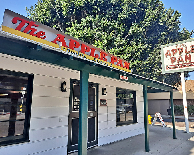 Green awnings frame this Pico Boulevard institution like a welcoming smile, promising comfort food without the fuss.