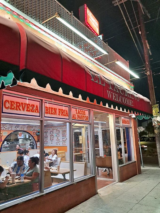 The red awning beckons like a matador's cape, drawing hungry patrons into this temple of authentic Mexican cuisine where cold cerveza and al pastor tacos await.