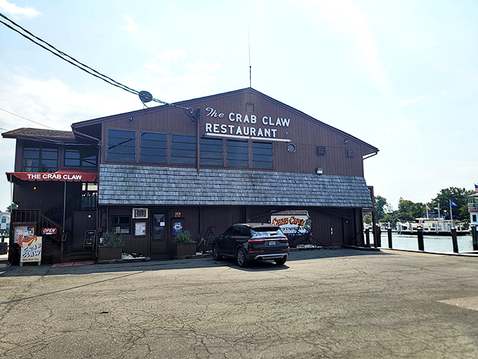 The unassuming wooden exterior of The Crab Claw stands like a sentry guarding Maryland's seafood secrets. Waterfront location? Check. Authentic vibe? Double check.