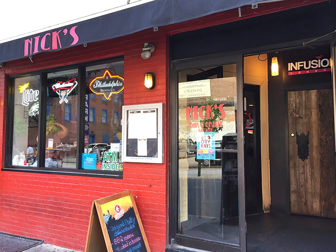 That iconic red storefront with its neon beer signs is like a beacon for hungry Philadelphians who know that sometimes the best flavors come without fancy facades.
