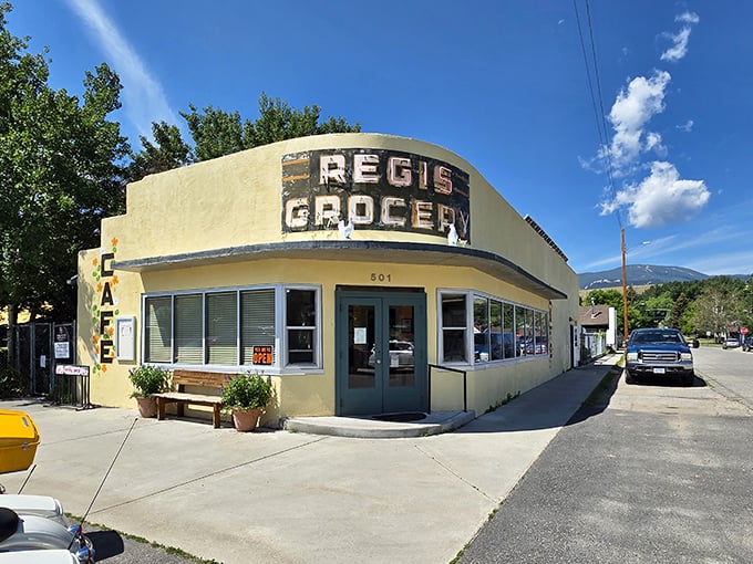 The iconic yellow facade of Café Regis stands as a beacon of breakfast hope in Red Lodge, where "grocery" history meets modern culinary magic.