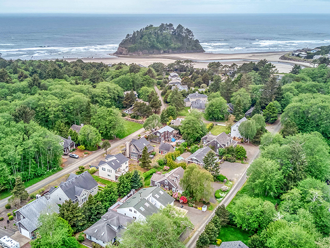 Neskowin's perfect harmony: lush greenery embraces charming homes while Proposal Rock stands sentinel over a beach that whispers, "Slow down, you've arrived."