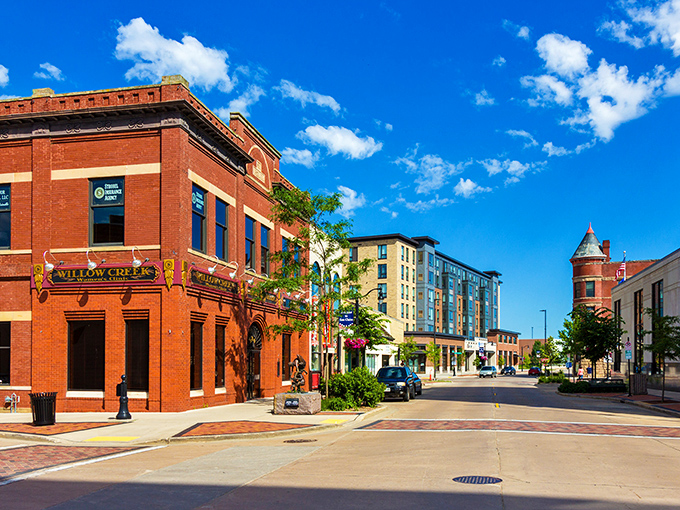 Downtown Eau Claire's historic brick buildings stand as colorful sentinels of the past, while modern developments peek through, creating that perfect "then meets now" vibe.
