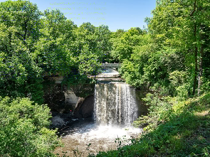 The main attraction doesn't disappoint &ndash; Minneopa Falls cascades dramatically through a lush green gorge, nature's own theater production.