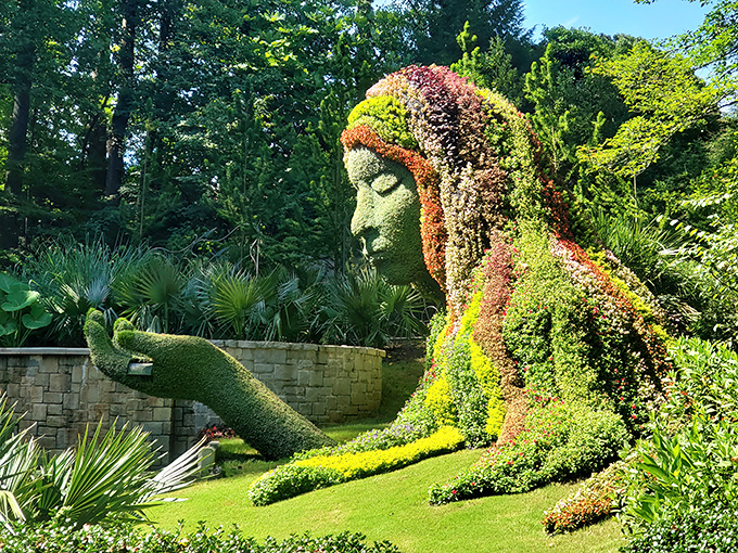 The Earth Goddess sculpture cradles nature in her palm, proving plants can indeed have better hairstyles than most of us.