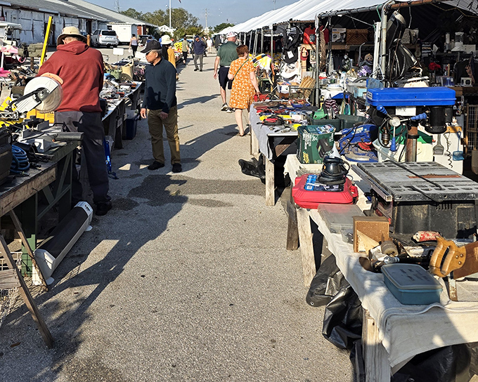 Treasure hunters navigate the aisles of Red Barn Flea Market, where one person's "I don't need this anymore" becomes another's "I've been looking everywhere for this!"