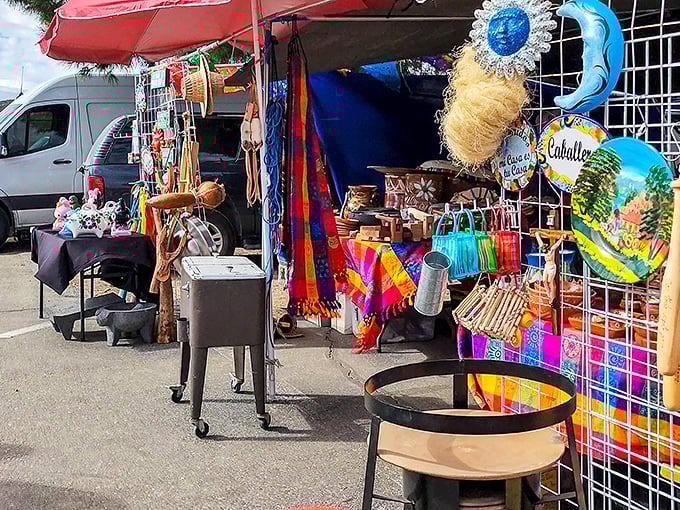 A kaleidoscope of colors greets you at this vendor's stall, where Mexican blankets and handcrafted treasures create a vibrant welcome to bargain paradise.