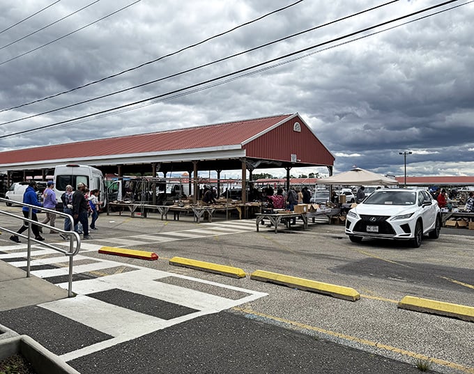 The iconic red-roofed pavilions of Columbus Flea Market stand ready for treasure hunters, rain or shine. New Jersey's bargain paradise awaits!