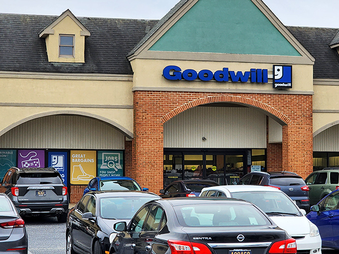 The beige and brick facade of Goodwill in Bear isn't just a storefront&mdash;it's the gateway to Delaware's most fascinating treasure hunt. Full parking lot? Always a good sign.