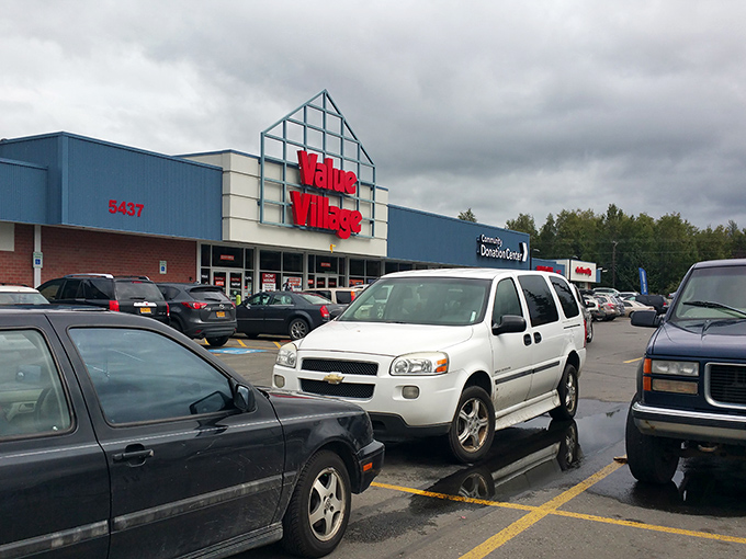 The blue-fronted fortress of frugality stands ready for bargain hunters, its triangular entrance beckoning like a North Star for the thrift-savvy Alaskan.