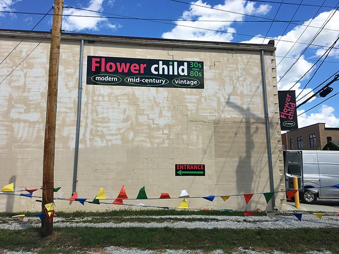 The unassuming exterior of Flower Child belies the time-traveling adventure within. Those colorful pennants are basically waving "come get weird with vintage treasures!"