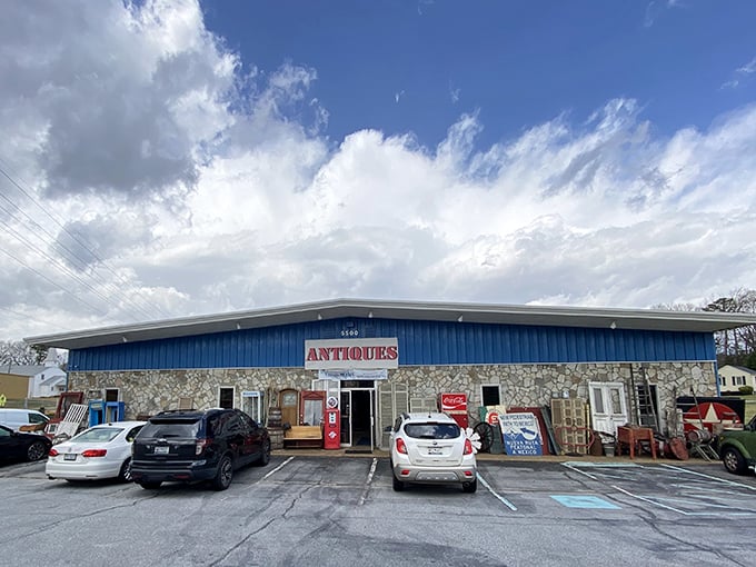 The stone and blue exterior promises treasures within – and that vintage gas pump outside isn't just for show!