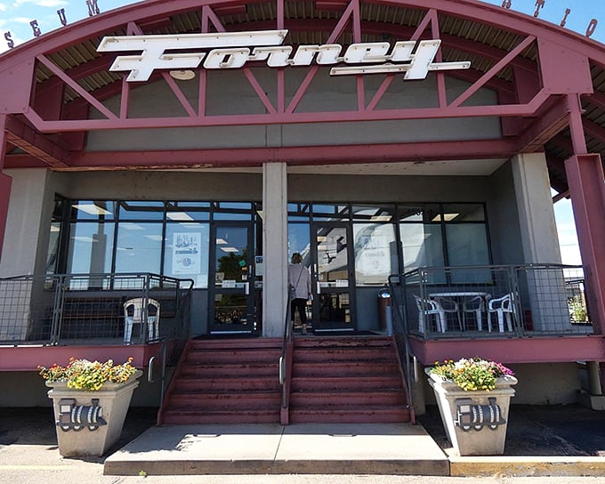 The unassuming entrance to the Forney Museum beckons with retro charm and a hint of industrial chic. Like finding a secret doorway to transportation's greatest hits.