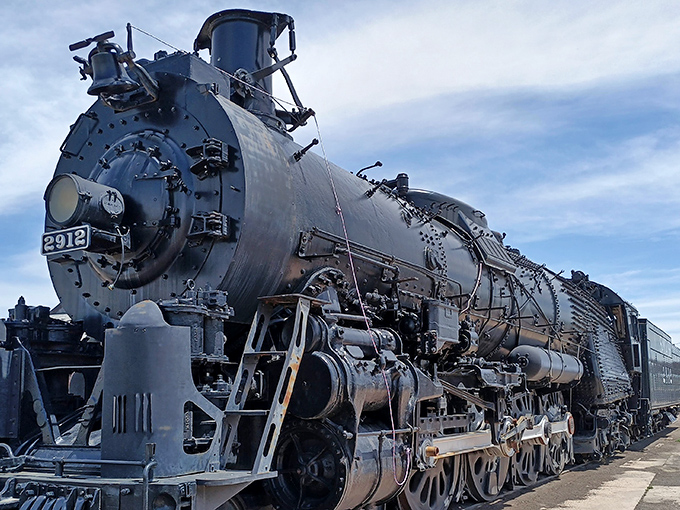 The mighty steam locomotive #2912 stands like a sleeping giant, ready to transport you back to America's golden age of rail.