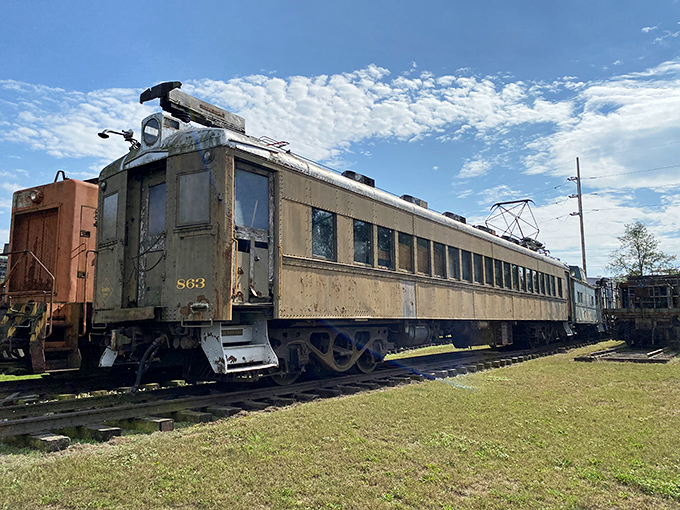 This vintage passenger car has seen thousands of travelers come and go, its weathered exterior a testament to journeys long past.