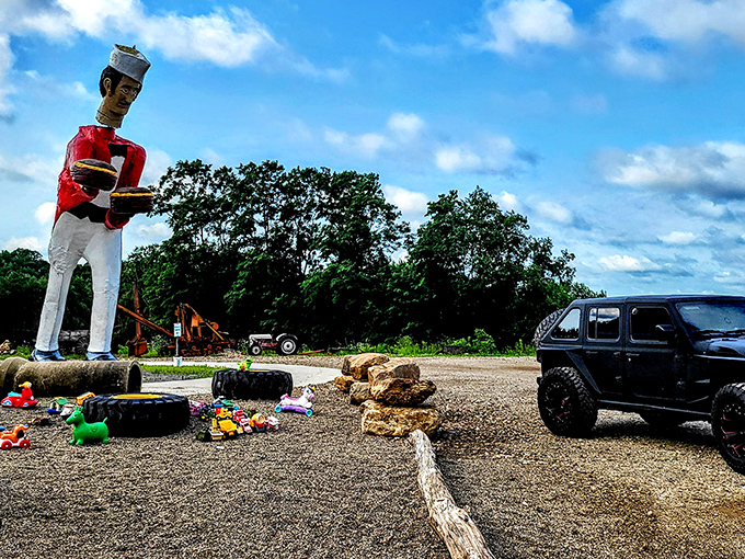 The gentle giant of Bellville strikes a pose with his oversized platters. At this scale, you'd need a ladder just to check if dinner's ready!