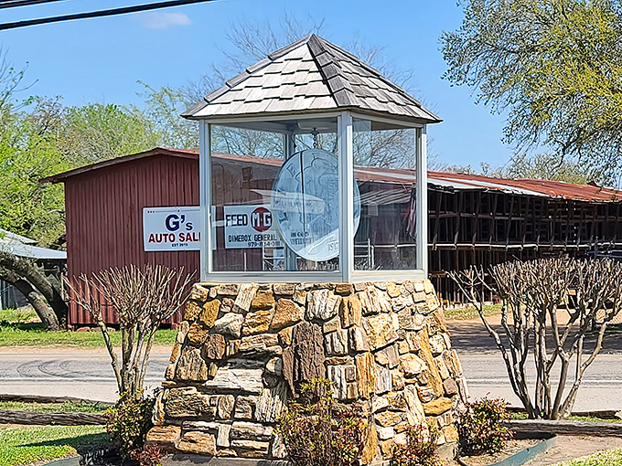 The ultimate literal landmark! Dime Box's namesake monument stands proudly on a rustic stone base, proving some towns really do take their names seriously.