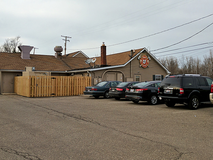 The unassuming exterior of Station 43 Tavern proves once again that culinary treasures often hide in plain sight, with that firefighter emblem promising heated delights within.