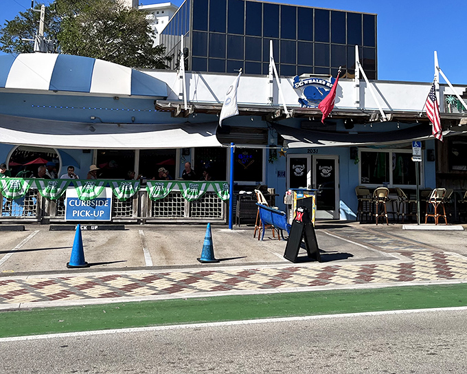 The blue and white exterior of The Whale's Rib stands like a maritime mirage on Deerfield Beach, complete with a boat hull that seems to have crashed into the building decades ago.