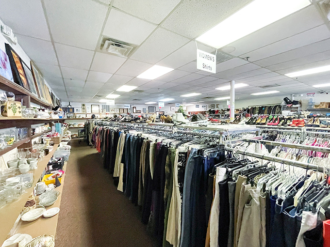 Treasure hunters paradise! Neatly organized racks stretch into the distance, promising fashion finds that won't empty your wallet. The women's suits sign hangs like a North Star for bargain navigators.