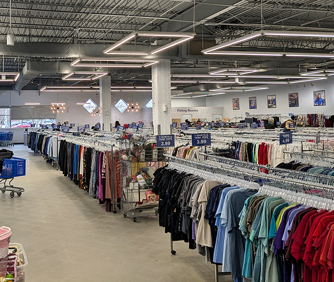 The treasure hunter's paradise: row after row of neatly organized clothing racks, each one a potential goldmine of fashion finds waiting to be discovered.