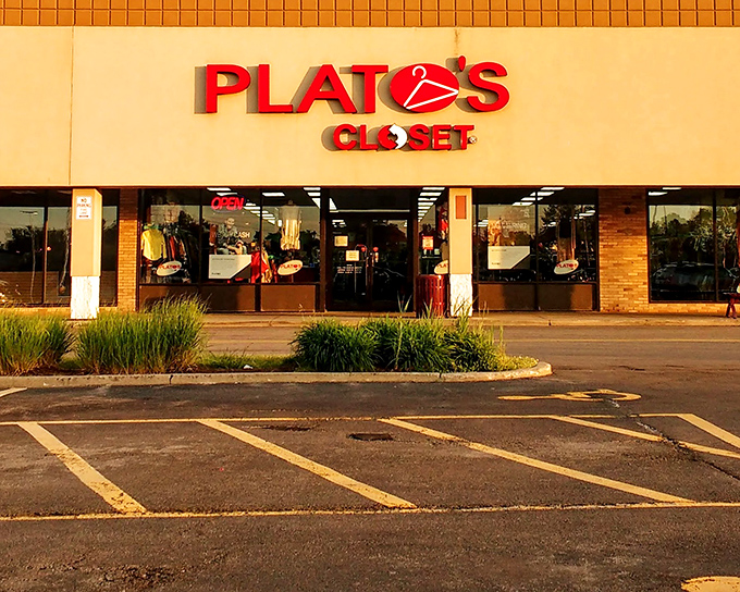 The iconic red signage of Plato's Closet beckons like a fashion lighthouse, promising treasure within those brick-framed windows. Your wallet is already breathing a sigh of relief.