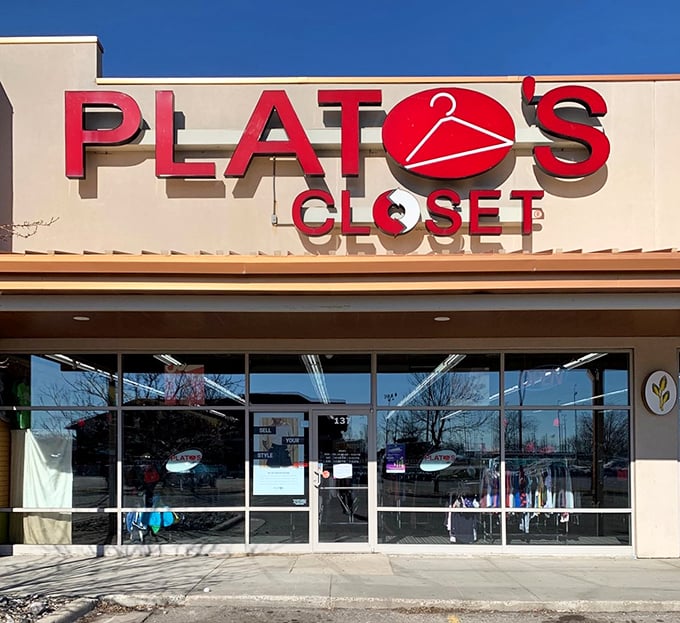 The iconic red sign of Plato's Closet beckons like a fashion lighthouse, guiding budget-conscious shoppers through the sea of retail prices.