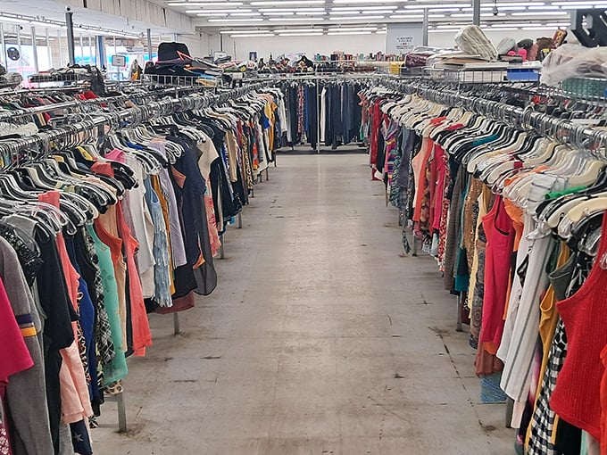 Rows upon rows of colorful clothing create a textile rainbow that stretches as far as the eye can see. Treasure hunting has never looked so organized!