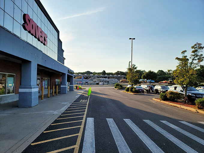 The iconic red Savers sign beckons like a lighthouse for bargain hunters. This Warwick storefront promises treasures waiting to be discovered inside.