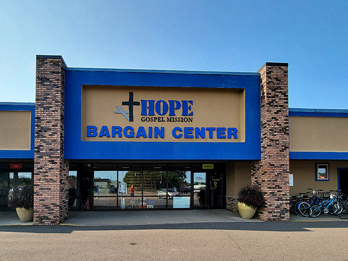 The blue facade of Hope Bargain Center stands like a beacon for bargain hunters, promising treasures within its brick-framed entrance.