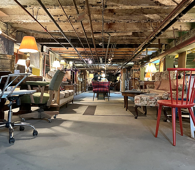 The crystal kingdom awaits! Vintage glassware gleams under chandeliers while an American flag stands guard over decades of memories and collectibles.