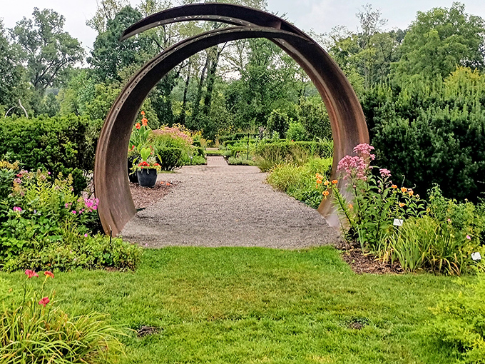 This elegant garden archway doesn't just invite you to walk through&mdash;it practically dares you not to imagine you're entering a secret world.