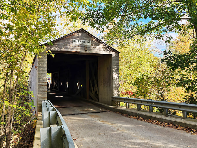 Bulls Bridge welcomes visitors with its weathered wooden charm, standing as a testament to Connecticut craftsmanship that's survived centuries of New England seasons.